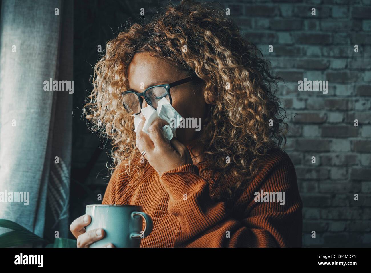 One woman sneezing nose with fever and influenza virus health disease ...