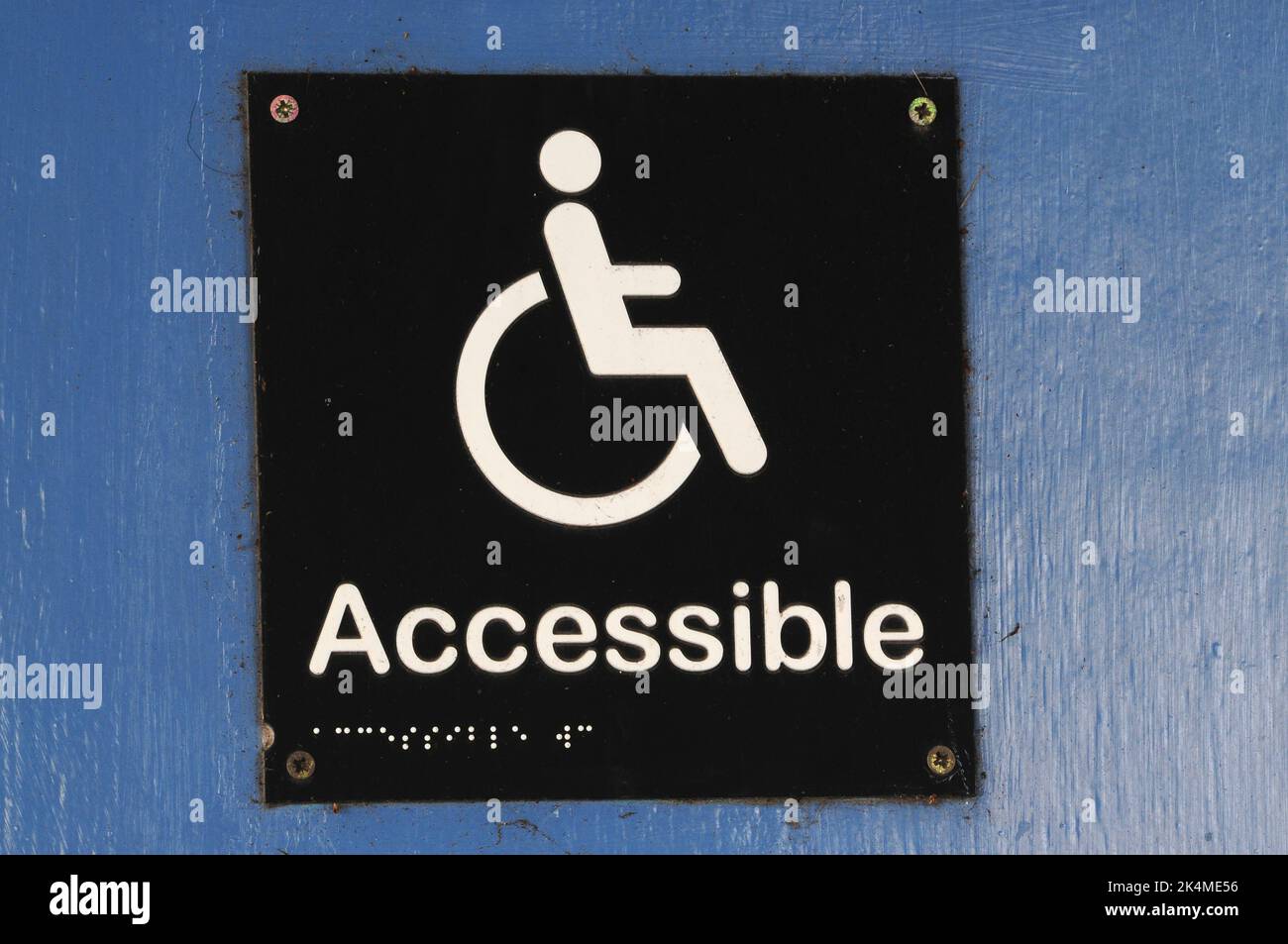 Wheelchair accessible sign on public toilets door Stock Photo - Alamy