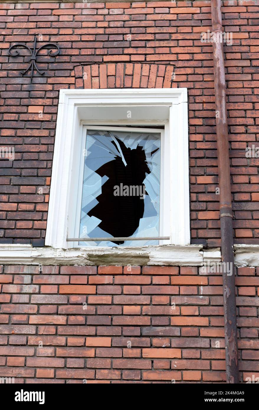 Symbolic image: Abandoned. empty, past, broken: single broken window in ...