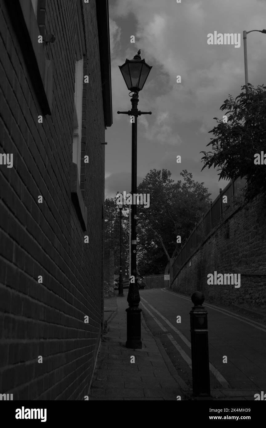 The retro style streetlight on the road ,vertical, grayscale Stock ...