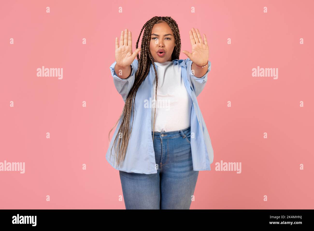 African American Woman Gesturing Stop With Both Hands, Pink Background ...