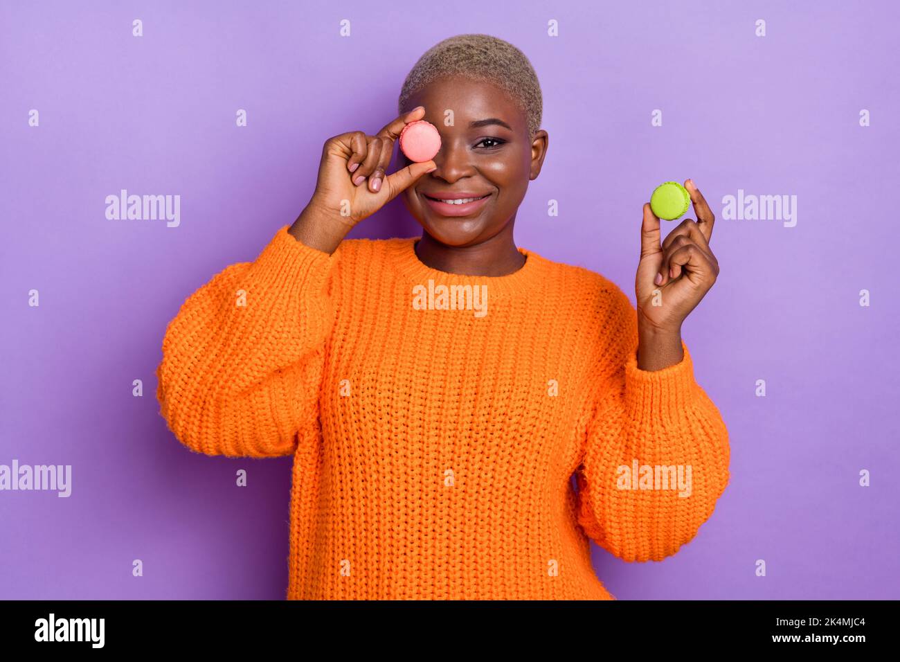 Photo of nice young woman macaroon cover eye have good mood wear trendy ...