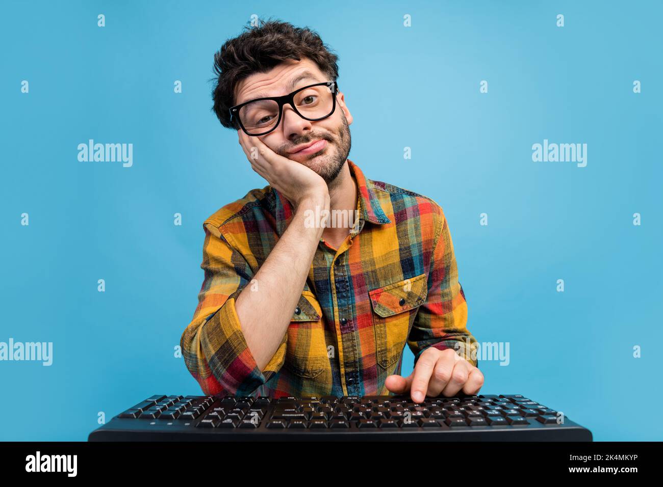 Photo of unhappy tired man in eyeglasses dressed checkered shirt ...
