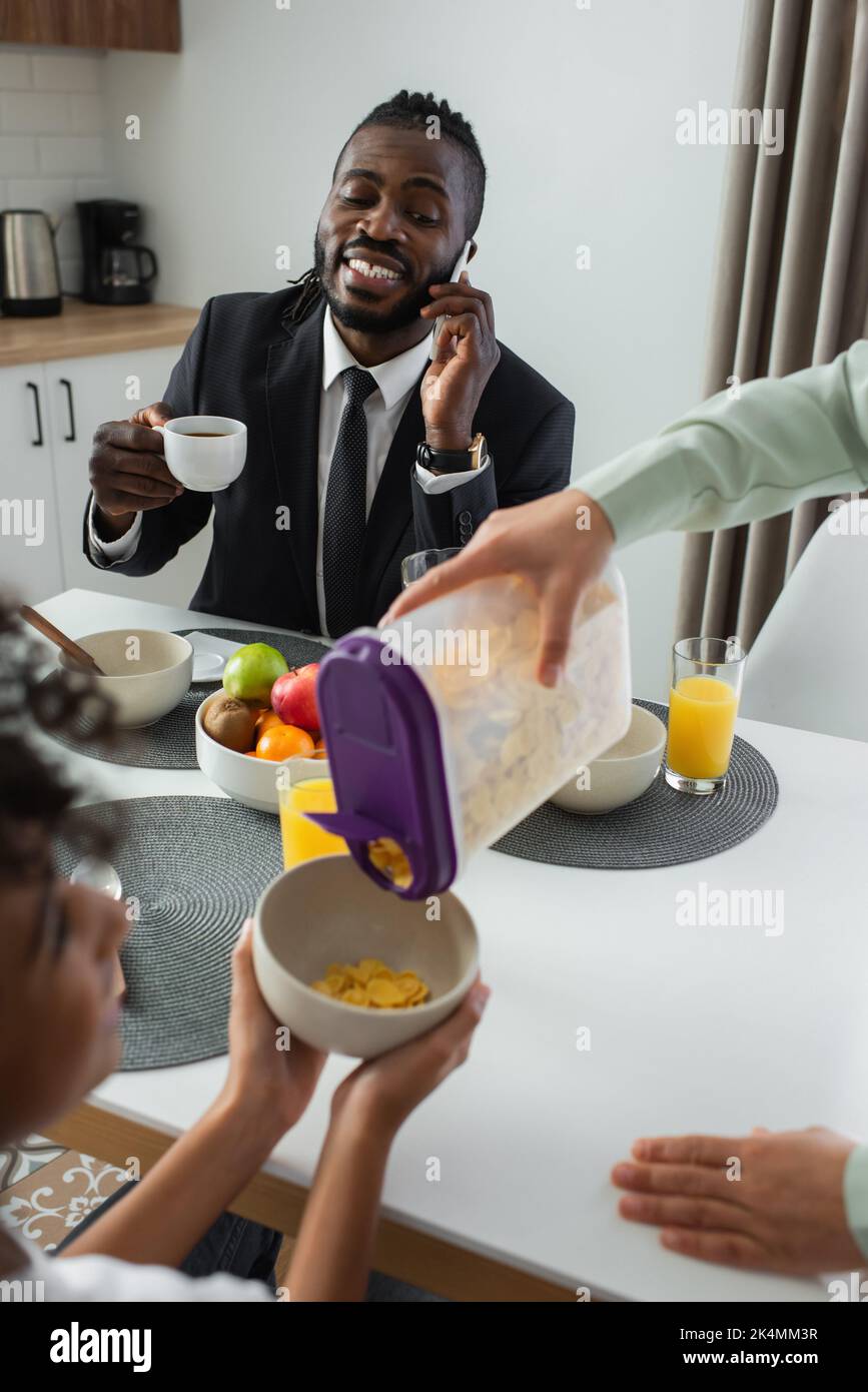 Woman in black suit talking hi-res stock photography and images - Alamy