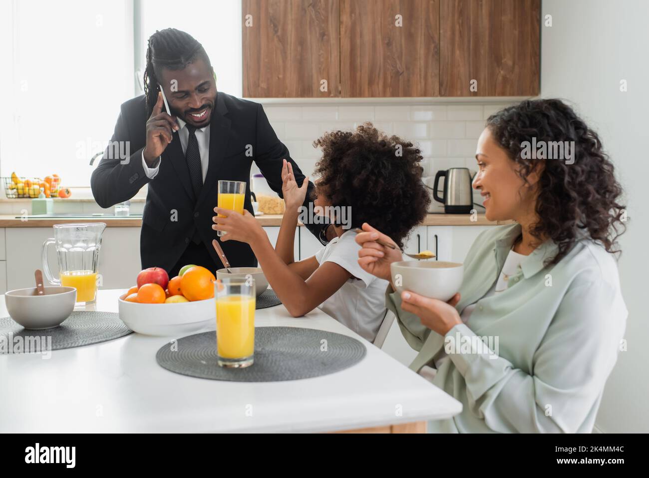 Black man talking wife kid hi-res stock photography and images - Alamy