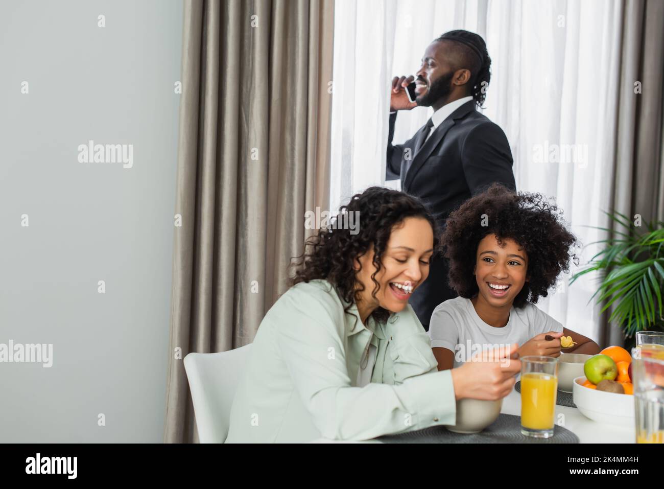 Black man talking wife kid hi-res stock photography and images - Alamy