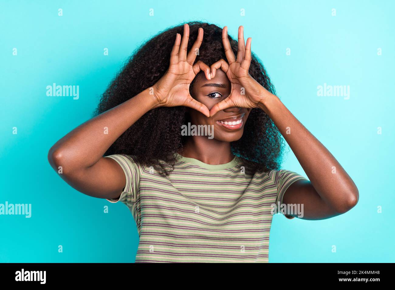 Photo of pretty adorable lady wear striped t-shirt looking inside arms ...