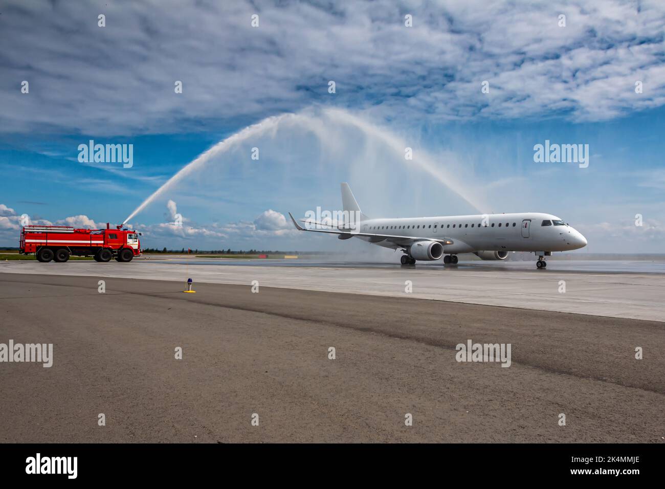 Water arch for first visit white passenger airliner at the airport ...