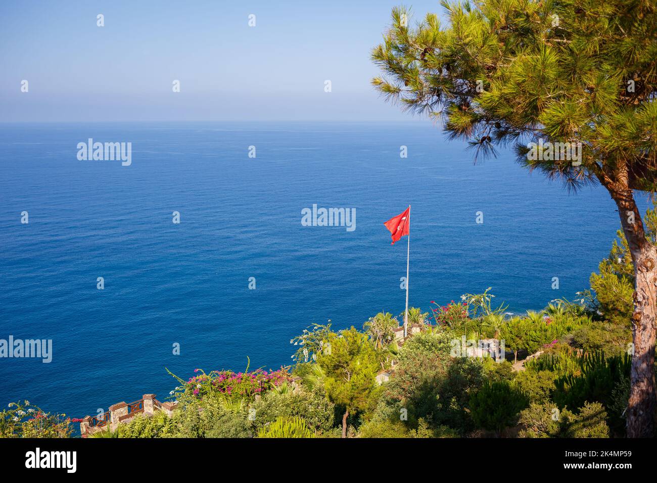 A view of the Mediterranean coast with waves of azure water. Summer ...
