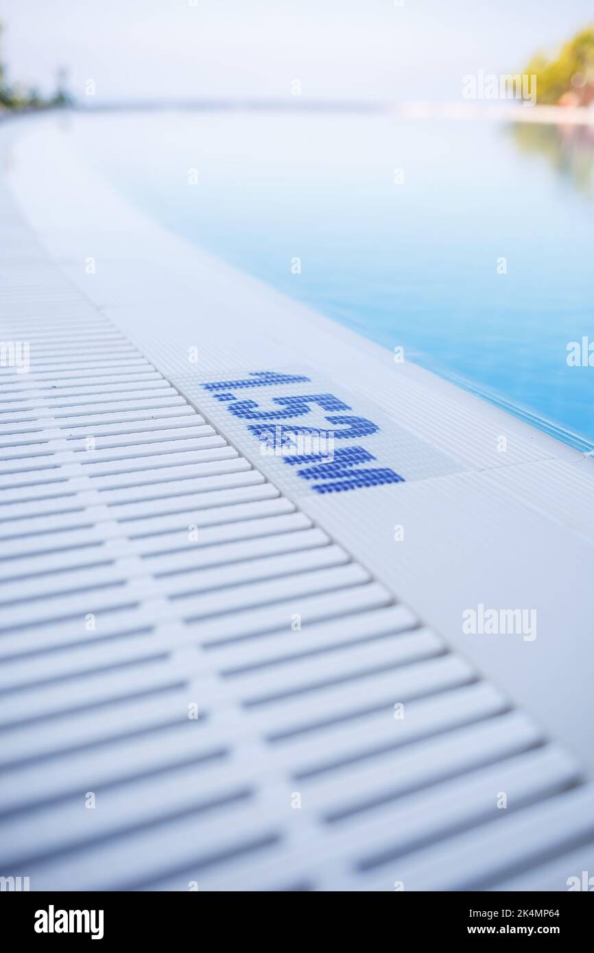 Swimming pool depth warning sign 1.52m for adults indicated on the side ...