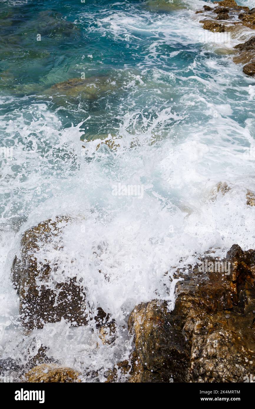 Wonderful views of the blue Mediterranean Sea. Sunny rocks, waves with ...