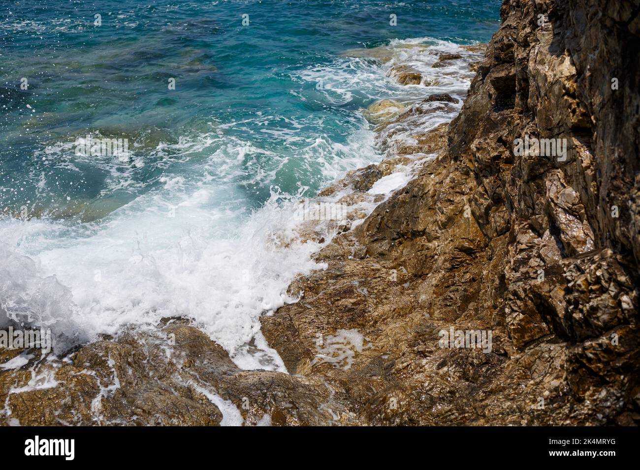 Wonderful views of the blue Mediterranean Sea. Sunny rocks, waves with ...
