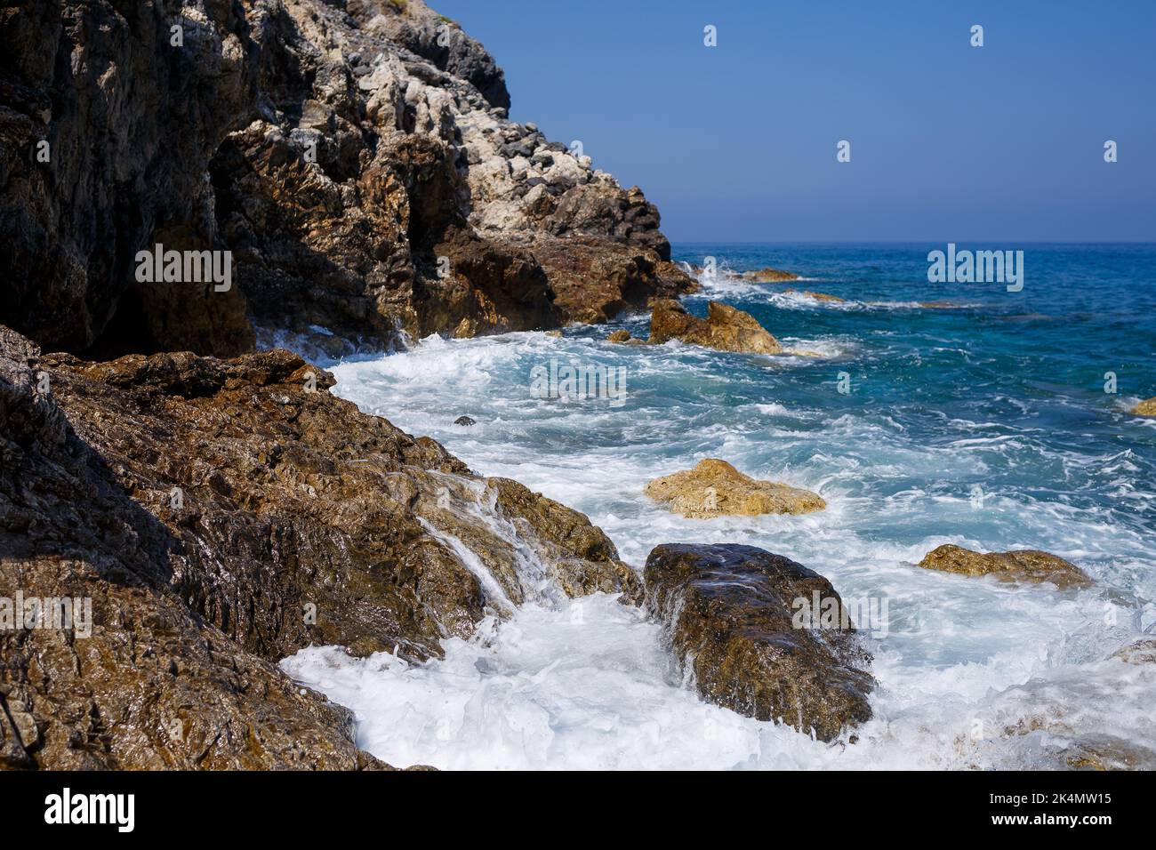 Wonderful views of the blue Mediterranean Sea. Sunny rocks, waves with ...