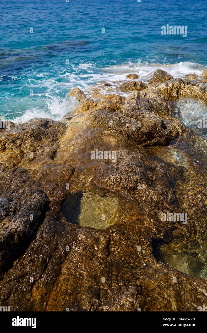 Wonderful views of the blue Mediterranean Sea. Sunny rocks, waves with ...