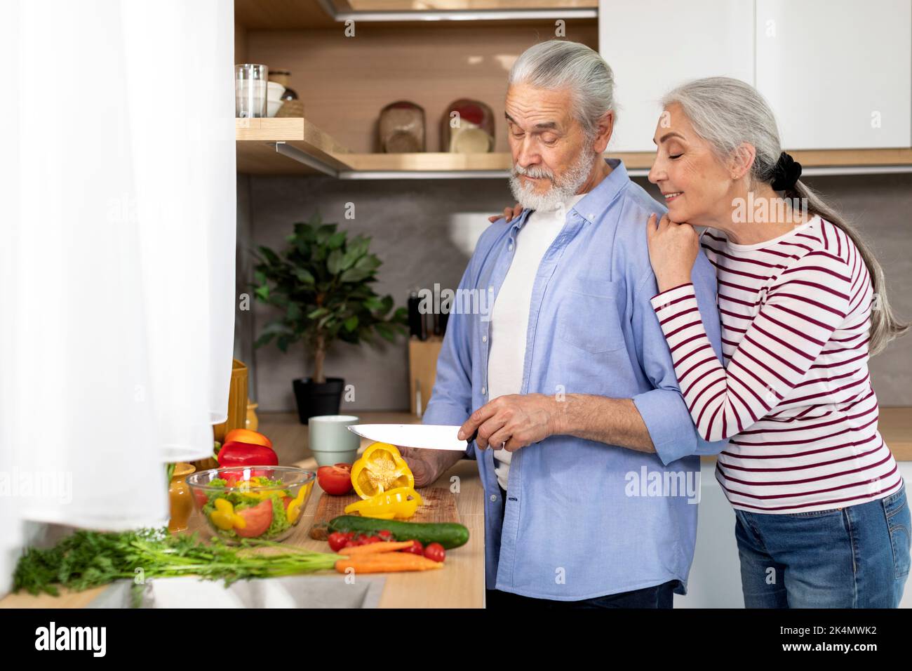 Family Recipes Concept. Happy Elderly Couple Cooking Food For Lunch At ...