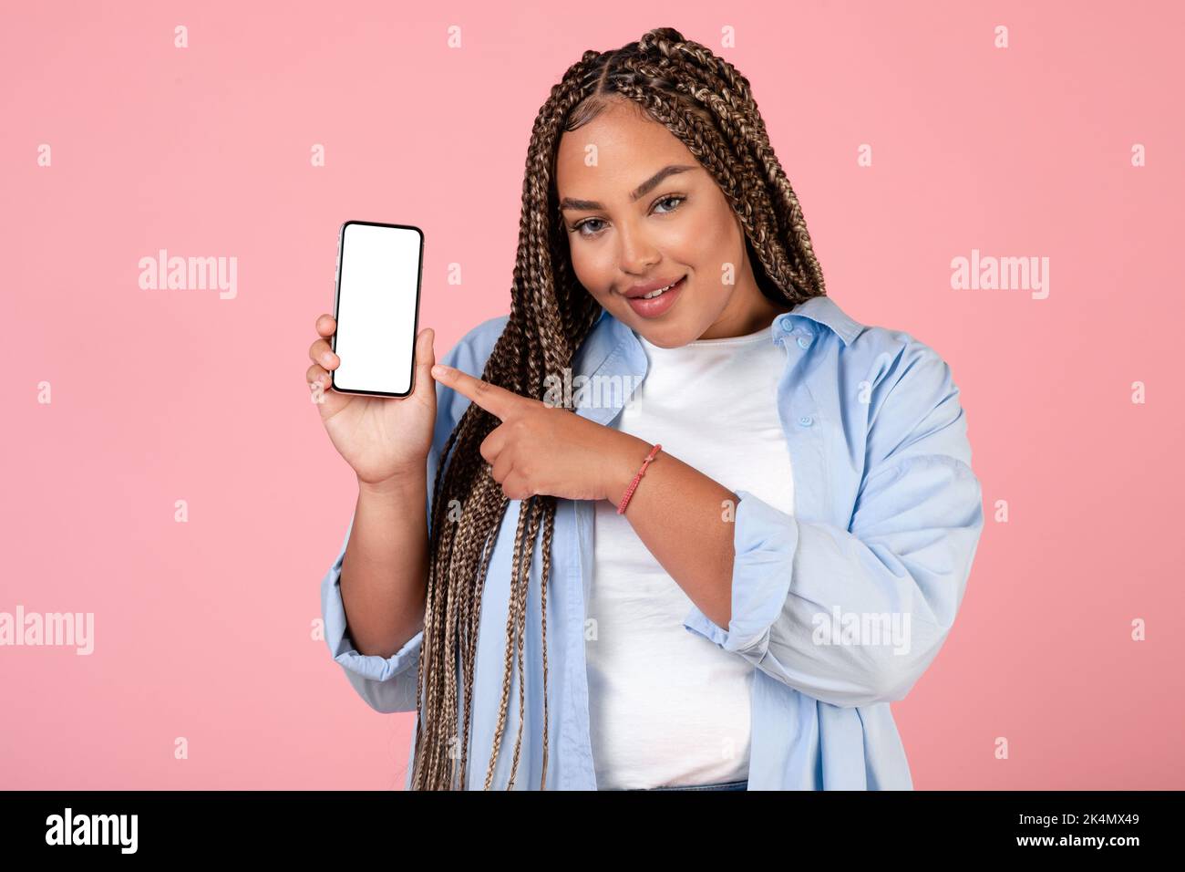 Cheerful African American Woman Showing Cellphone Over Pink Background ...
