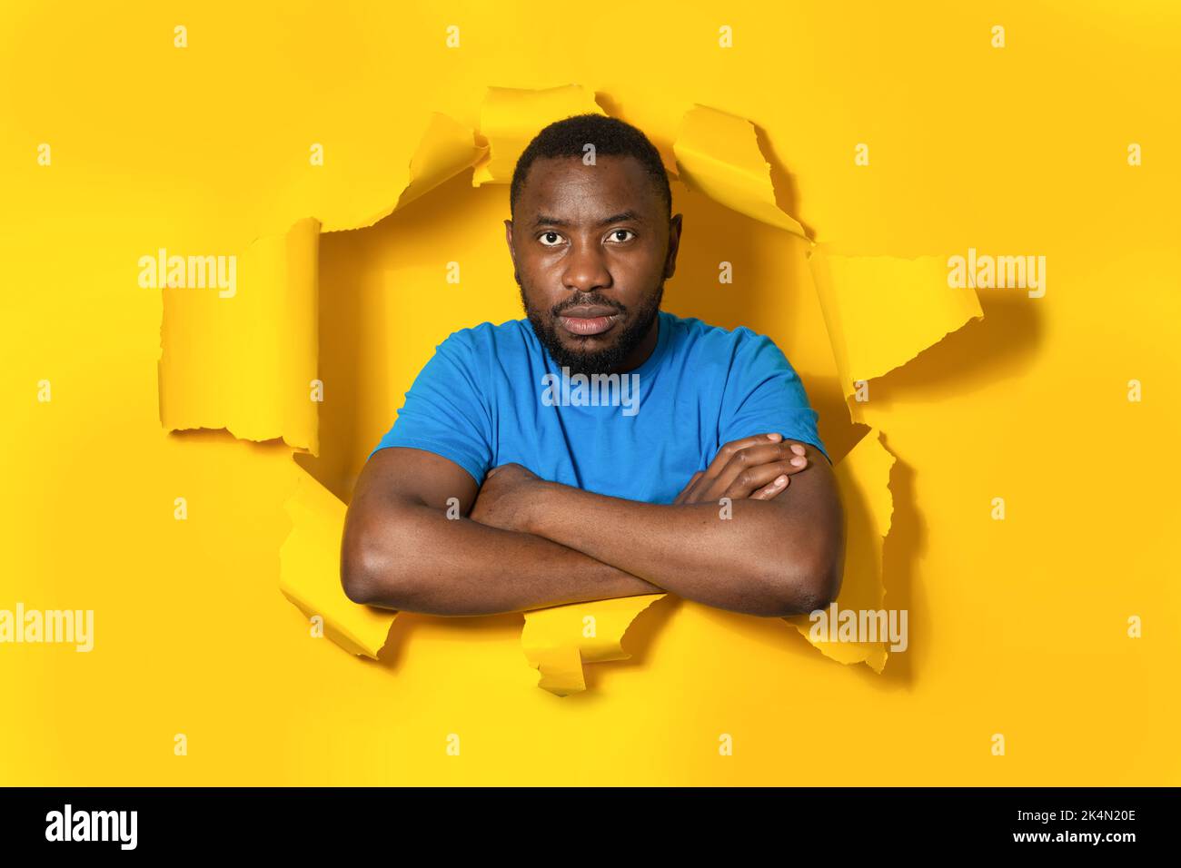 Angry displeased black man feeling outraged keeping arms folded, posing ...