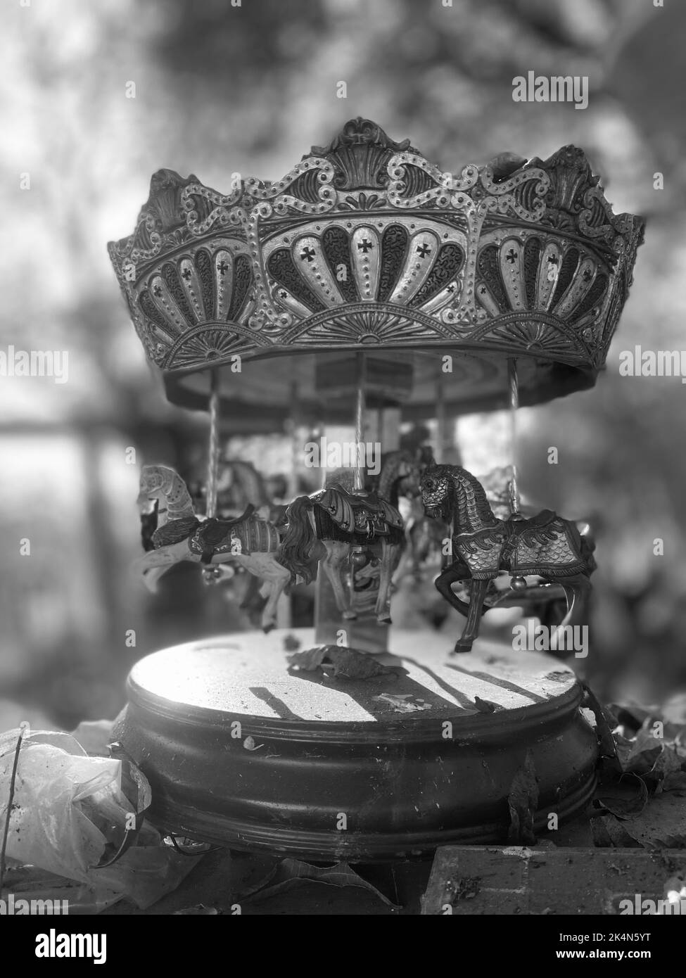 A vertical grayscale of a merry-go-round carousel toy with horses Stock ...