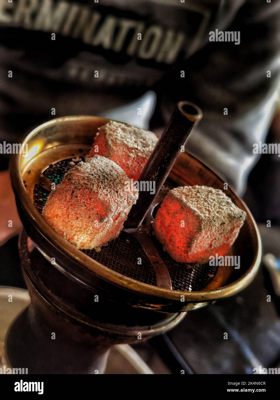 A vertical closeup shot of burning coal cubes on a hookah Stock Photo ...