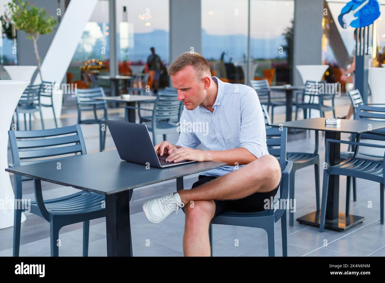 Successful male freelance businessman using laptop computer at work on ...