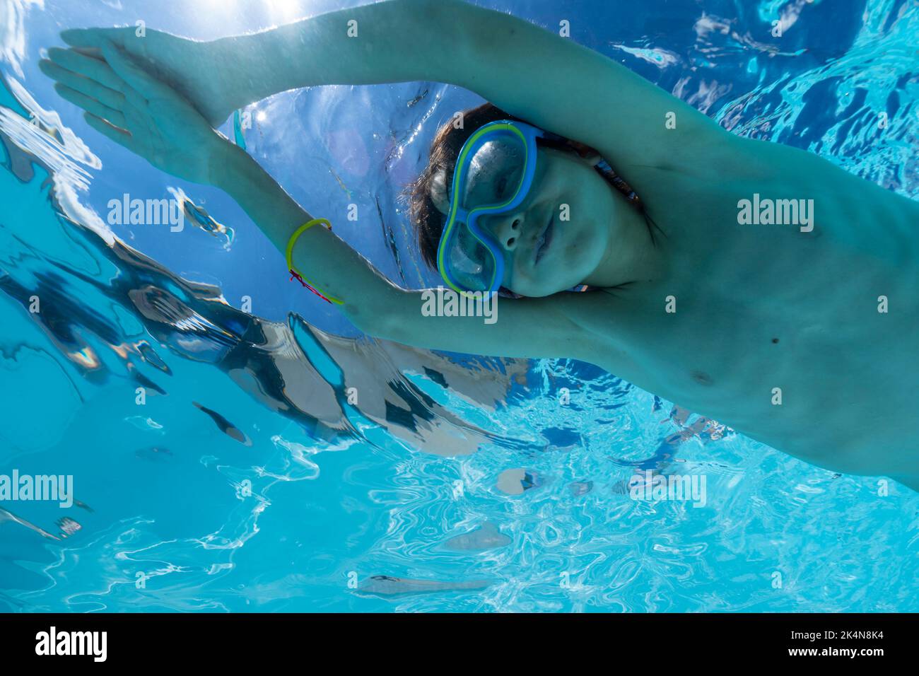 underwater view of a young boy swimming Stock Photo - Alamy