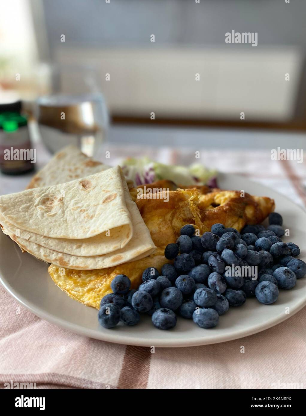 Healthy breakfast with blueberries, omelet, and lavash Stock Photo - Alamy