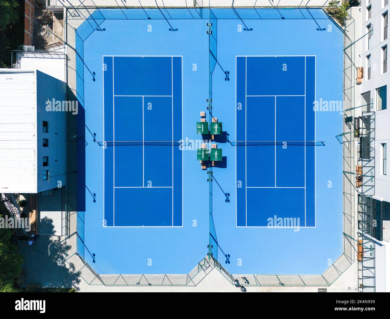 Beautiful top down view to blue hard tennis court with white lines ...