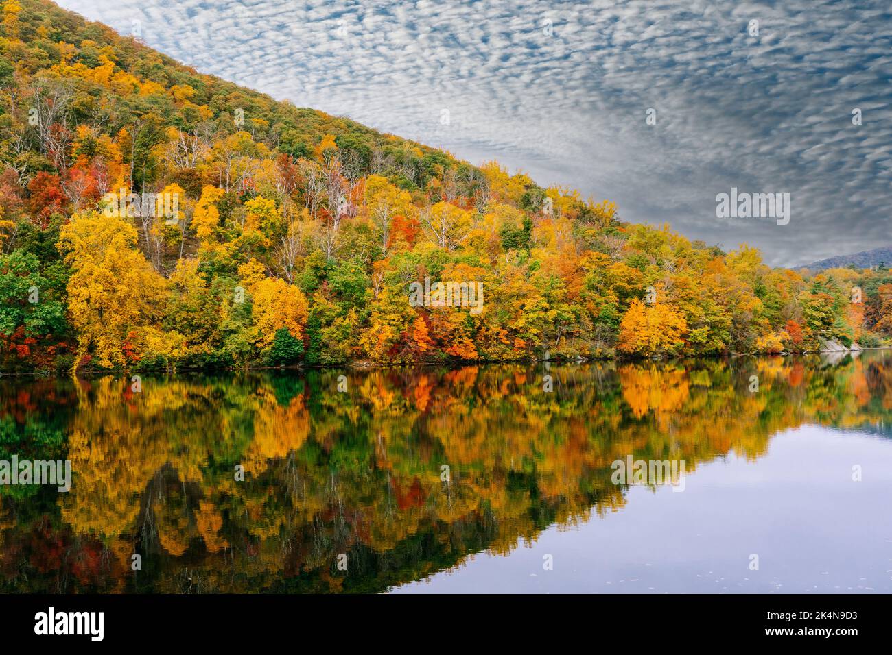 Colors of the fall with water reflection Stock Photo - Alamy