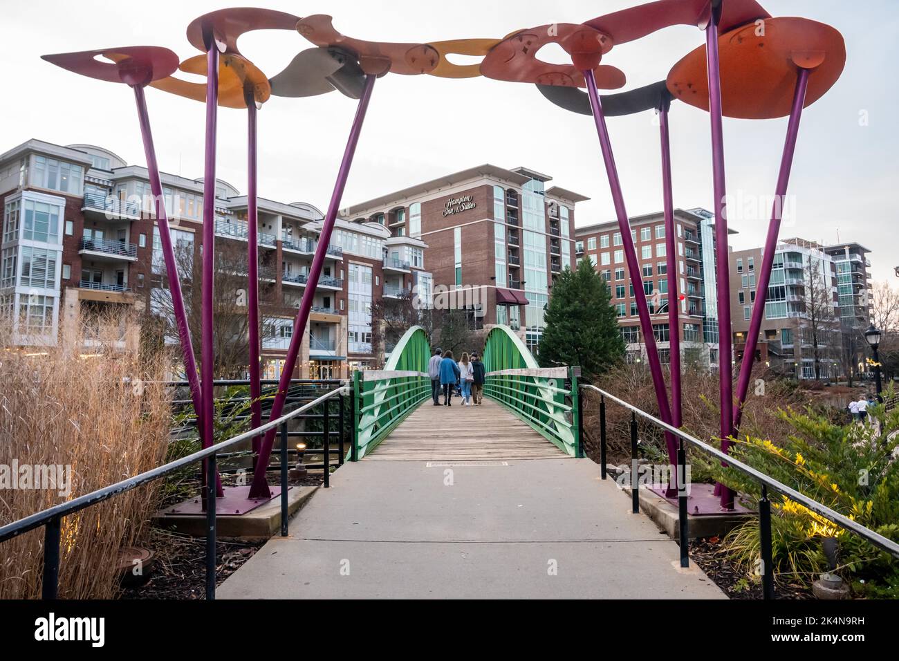 A bridge has a curved clear span over the river in Greenville, S Stock ...