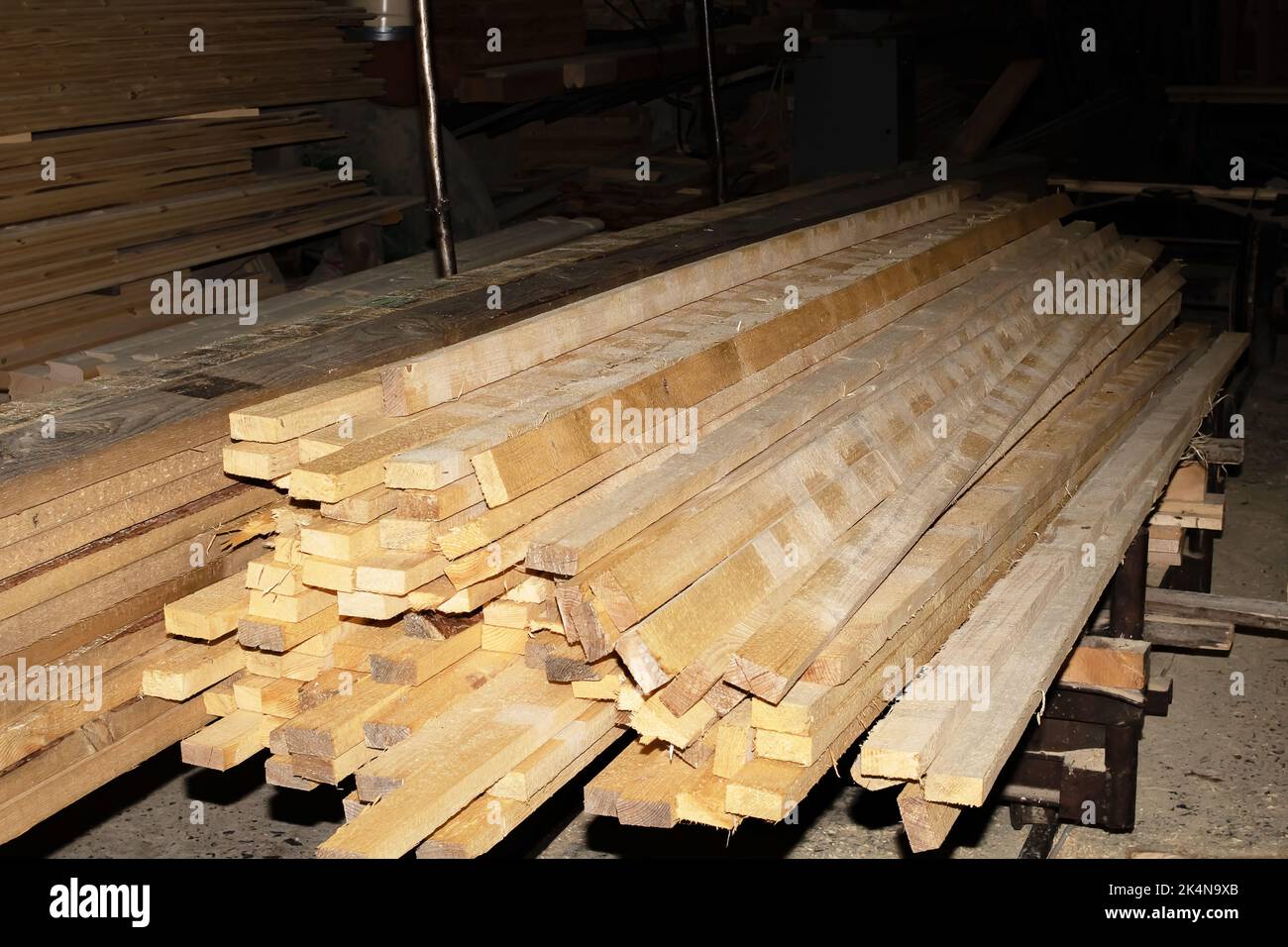 Folded finished boards at the sawmill close up Stock Photo - Alamy