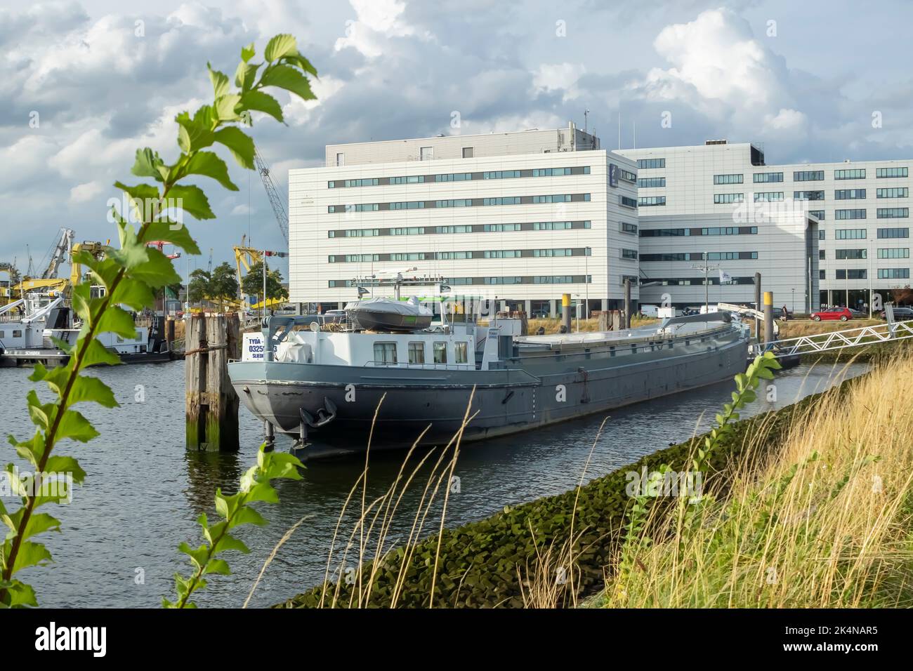 Ships and barges moored at Rotterdam port, The Netherlands Stock Photo ...