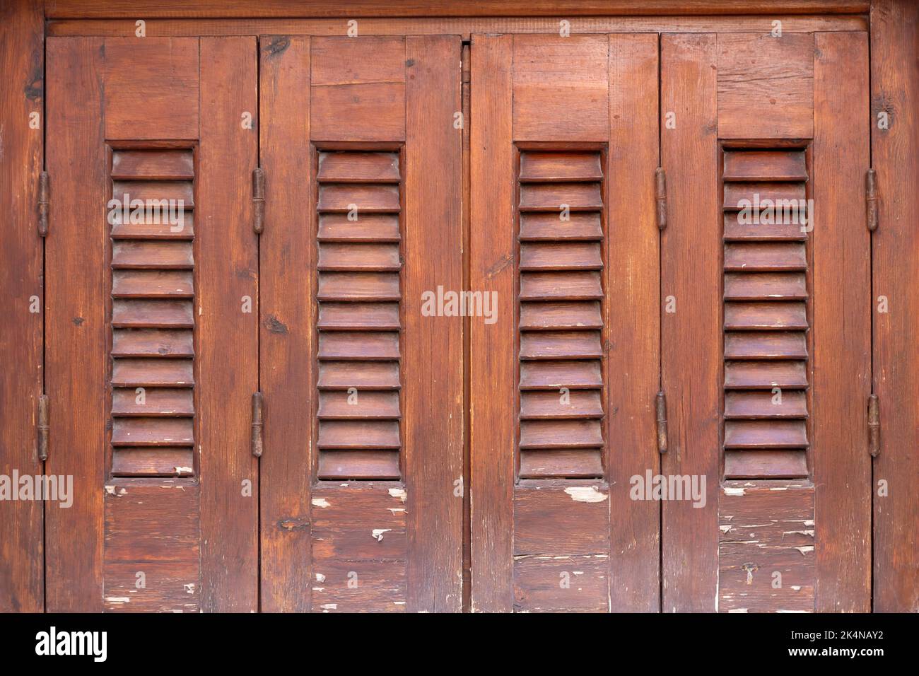 Wooden closed peeled shutters with frame background, texture ...