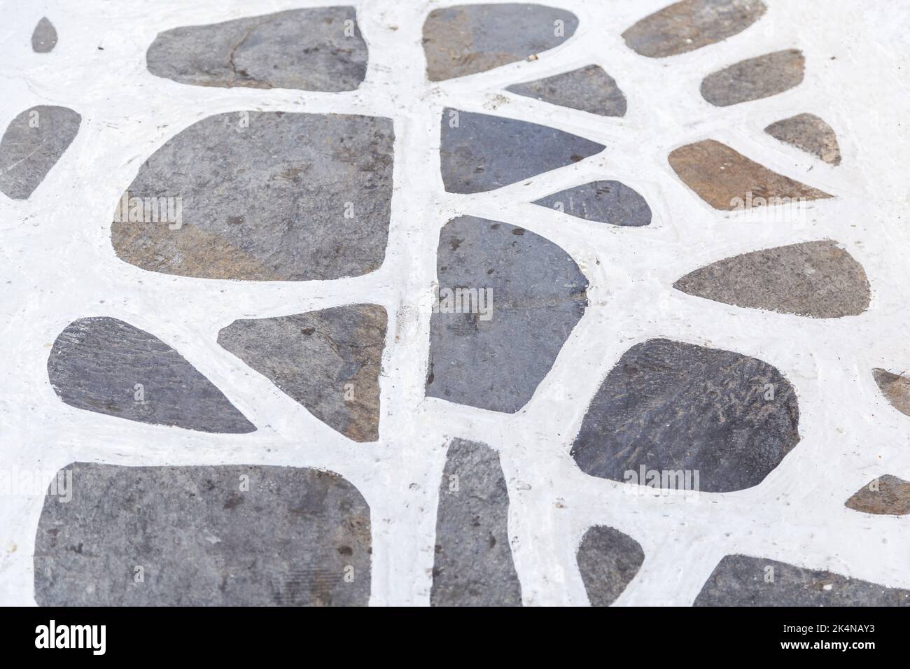 Paved stone street with whitewashed decorative design background ...