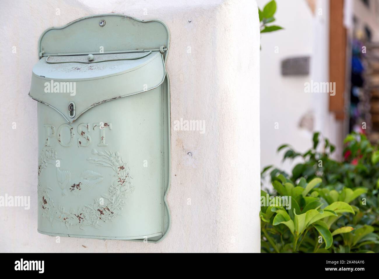 Old rusty metal mailbox on house wall background. Vintage exterior ...