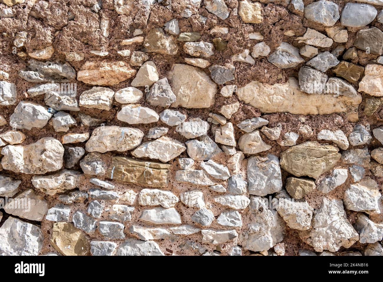 Rocky wall construction background texture. Old grey beige rough solid ... Rocky wall construction background texture. Old grey beige rough solid ...
