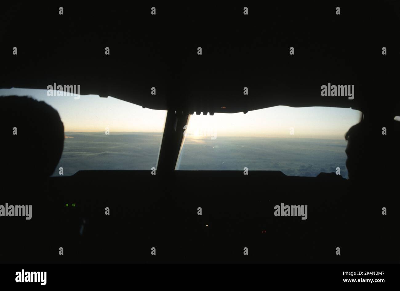 Flying towards the sunset in a USAF KC-10 Extender cockpit Stock Photo ...