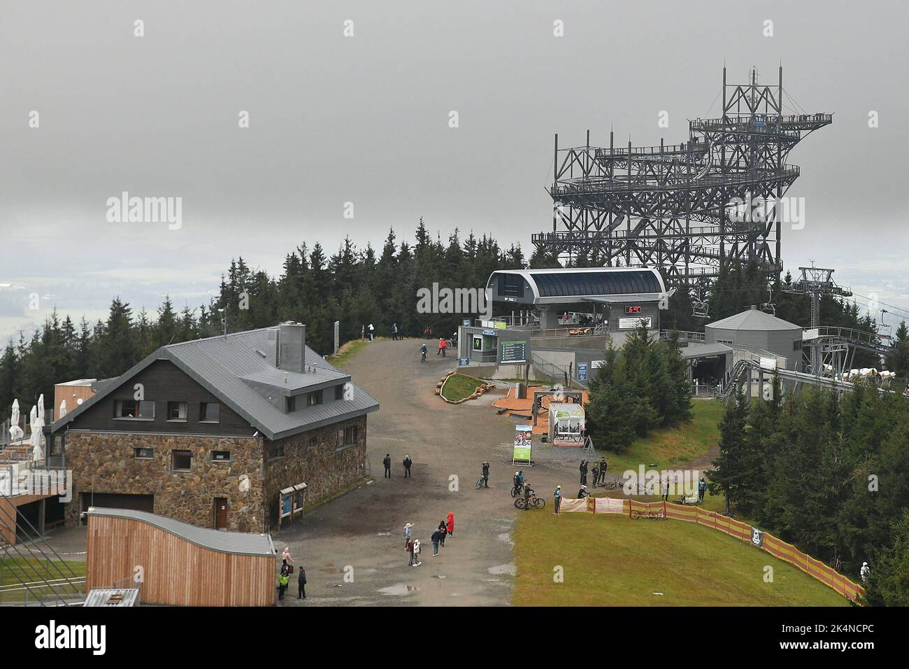 Tourists enjoy Sky Walk, a wooden structure 55 metres above the ground ...