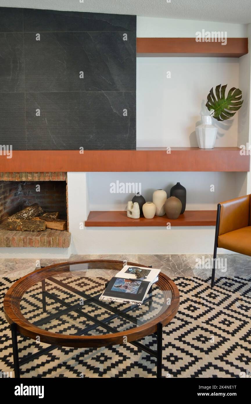 Double table in brown wood, with circular metal edges and several glass ...