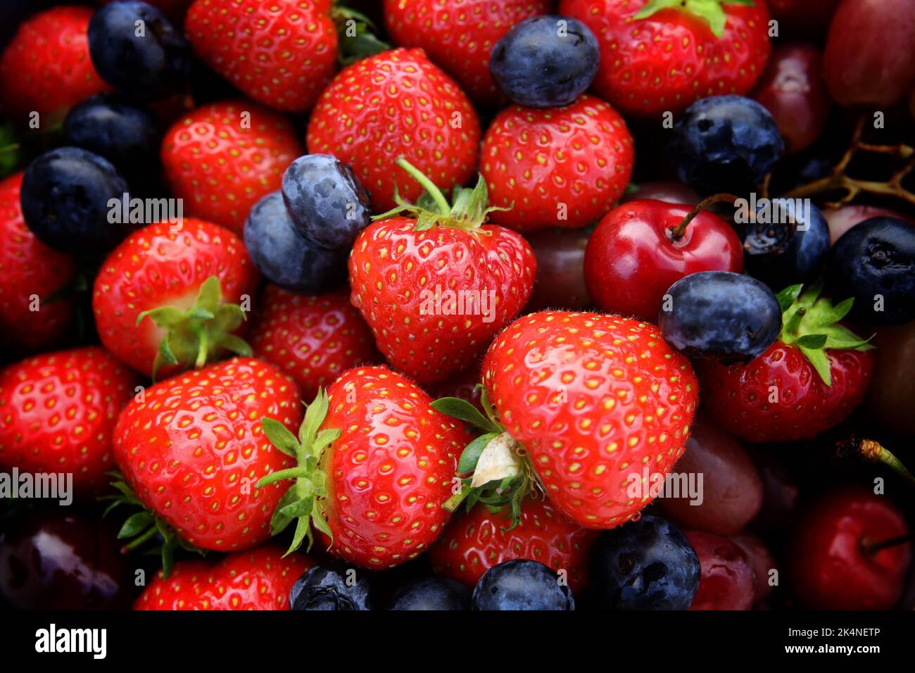 A collection of strawberries and grapes Stock Photo - Alamy
