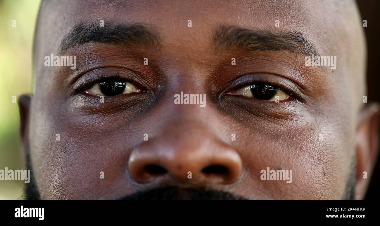 African man eyes close-up face looking at camera, macro closeup Stock ...
