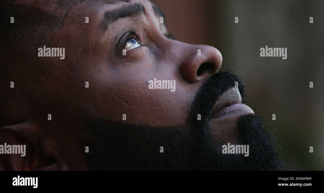 Faith african man looking sky hi-res stock photography and images - Alamy