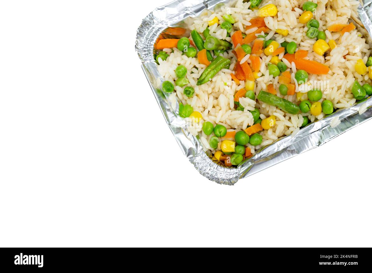 Portion of rice with mixed vegetables in a foil takeaway container and ...