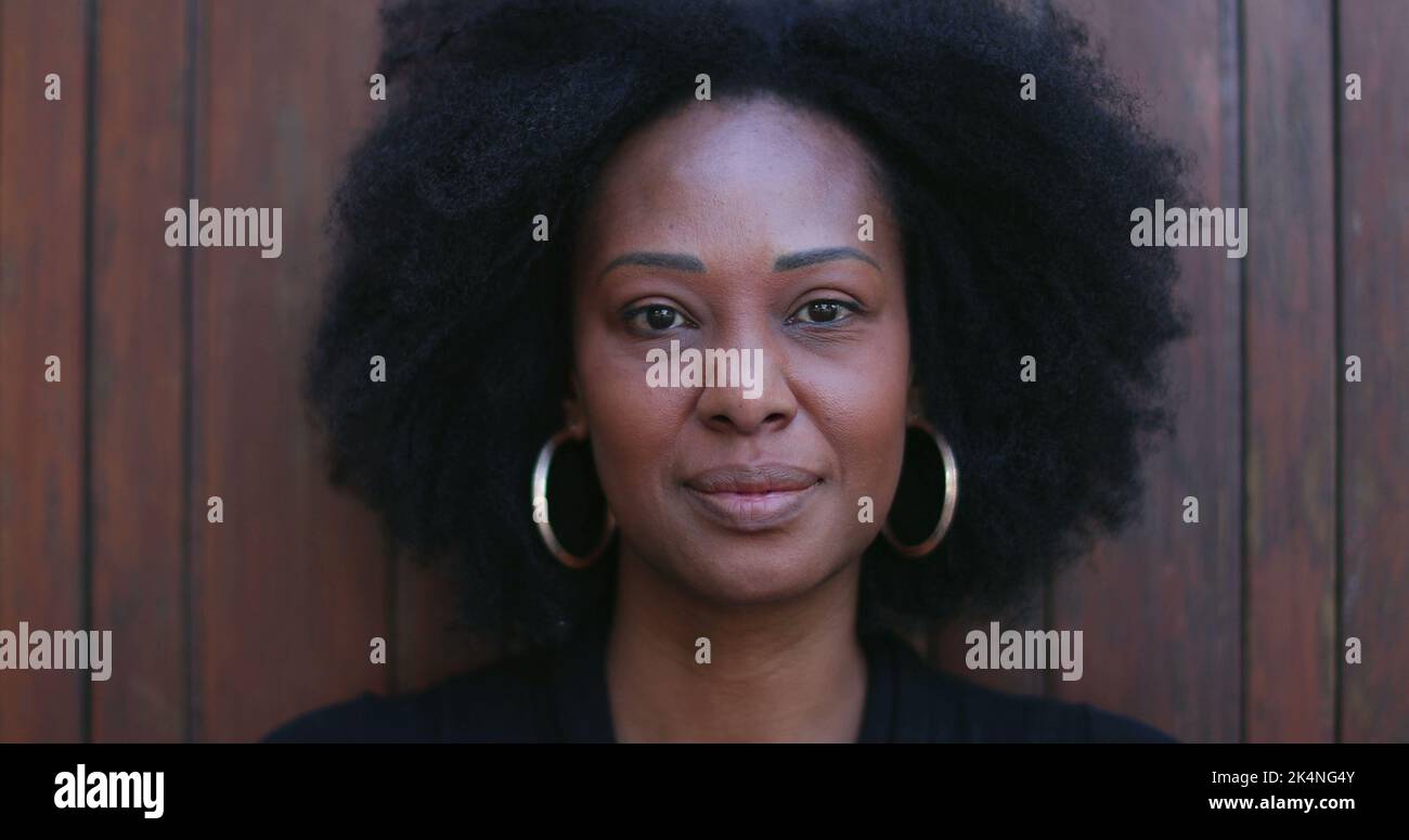 African woman portrait looking at camera. Black person close-up face ...