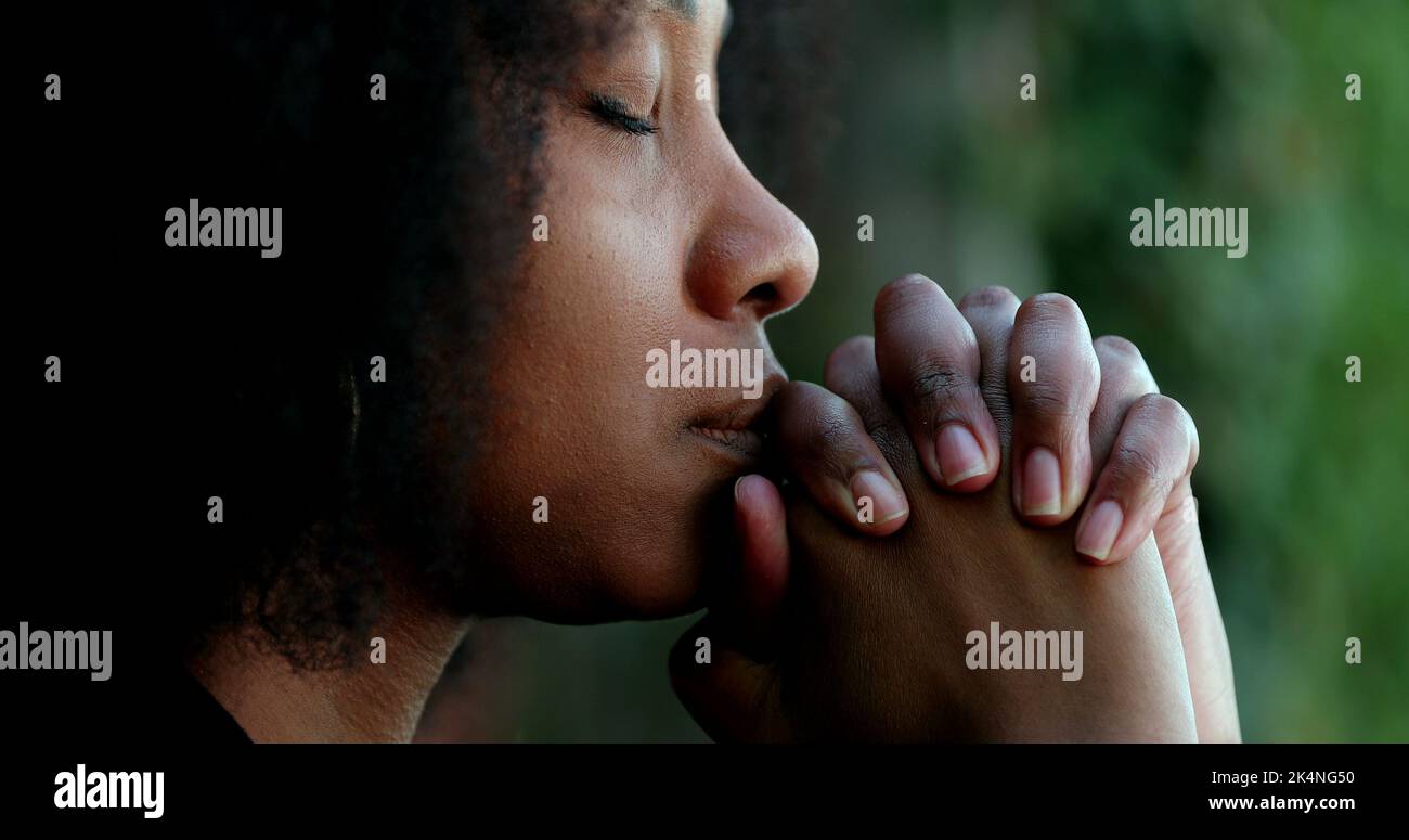African woman praying to God Stock Photo - Alamy