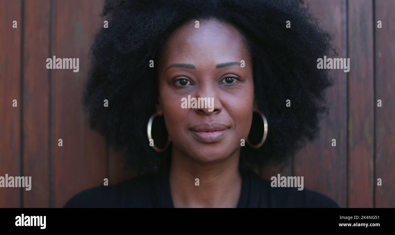 African woman portrait looking at camera. Black person close-up face ...