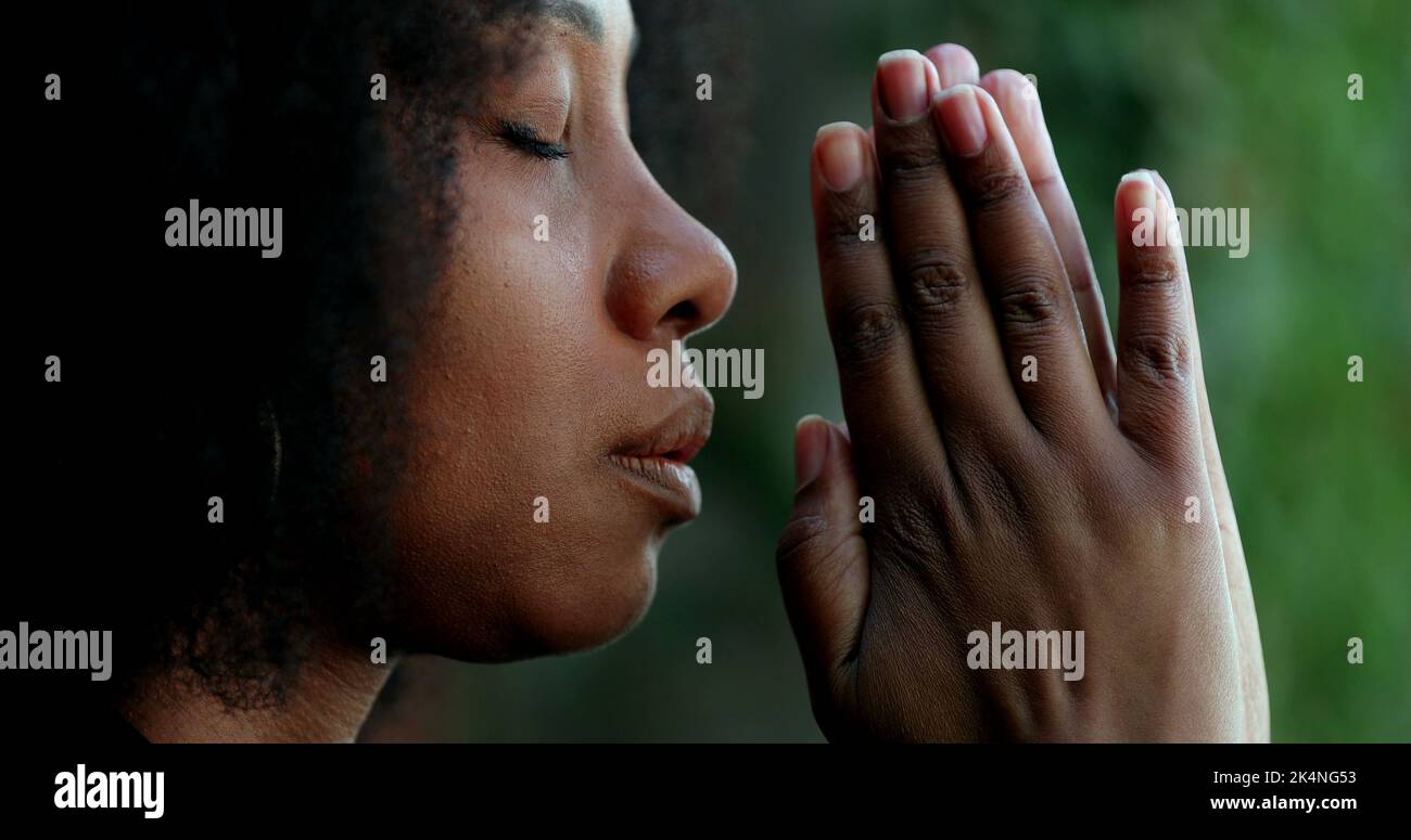 African woman praying to God Stock Photo - Alamy