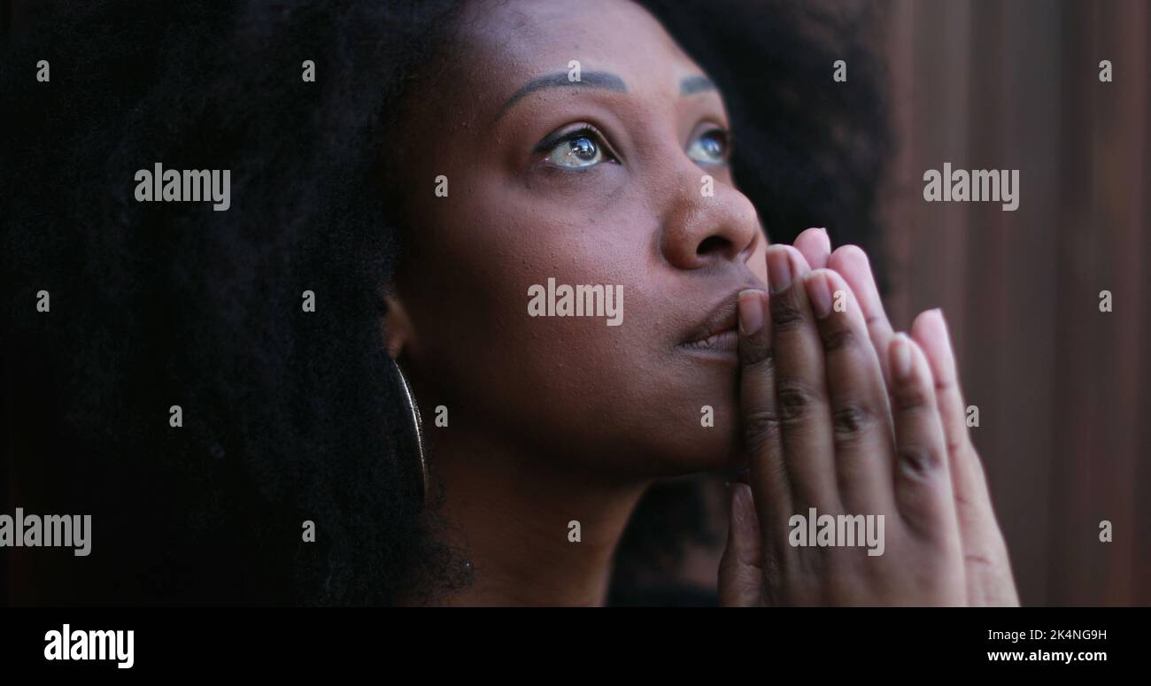African woman praying god seeking hi-res stock photography and images ...