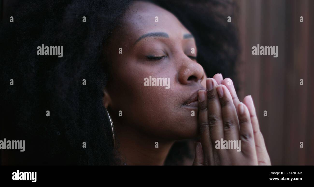 Hopeful African woman praying to God seeking FAITH and HOPE Stock Photo ...