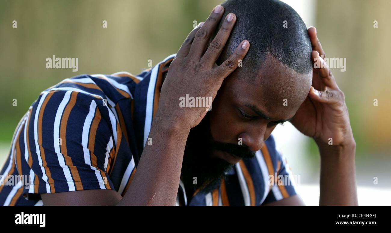 Pensive preoccupied black African person seeking solution Stock Photo ...