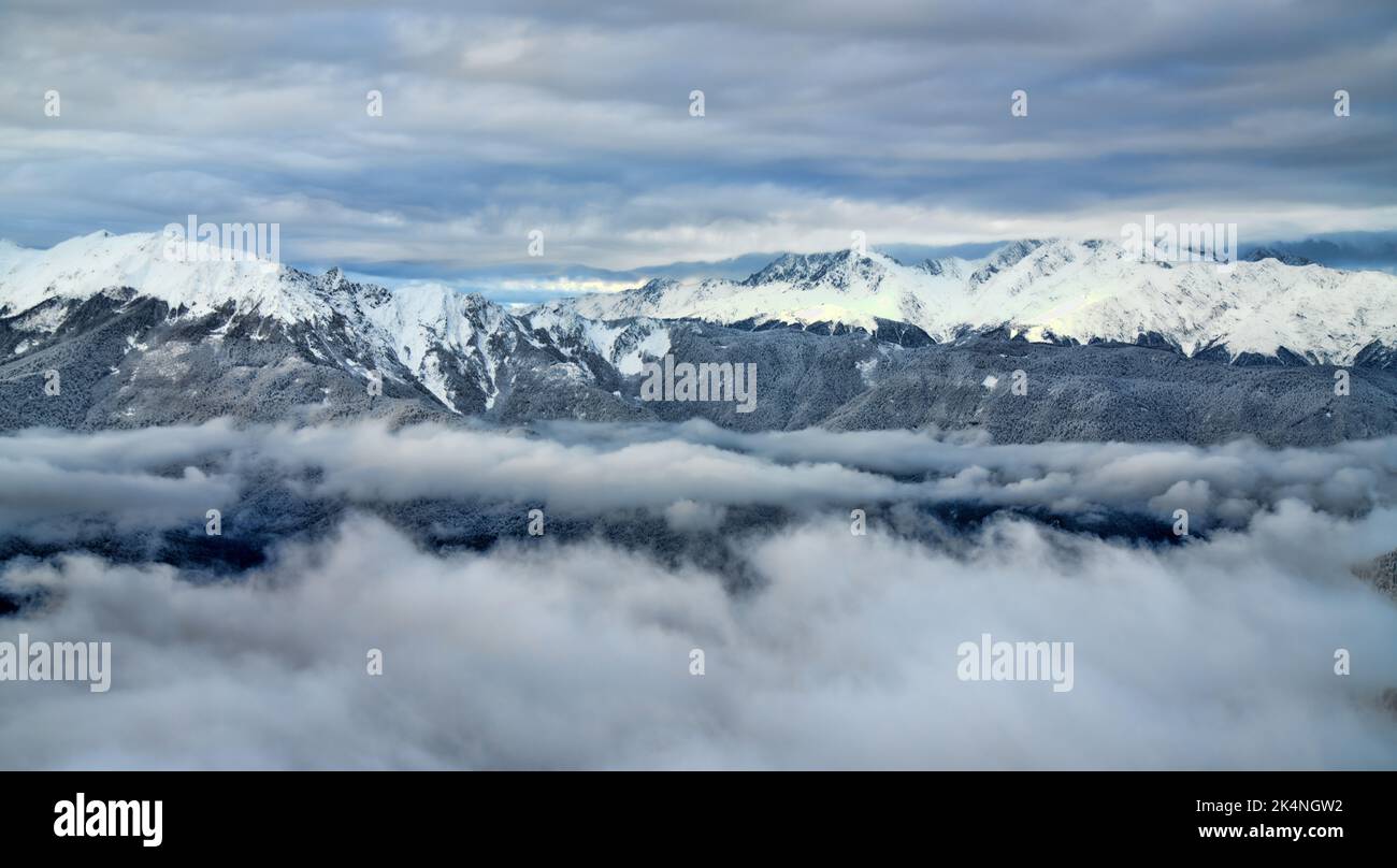 After heavy snowfall. Clouds covered the valley, mountain peaks are ...
